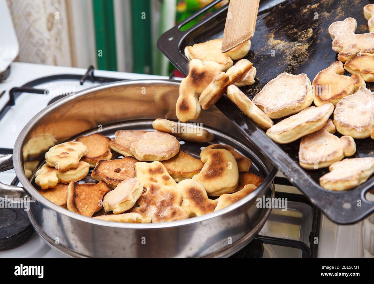 woman bake homemade cookies in the kitchen. coronavirus quarantine ...
