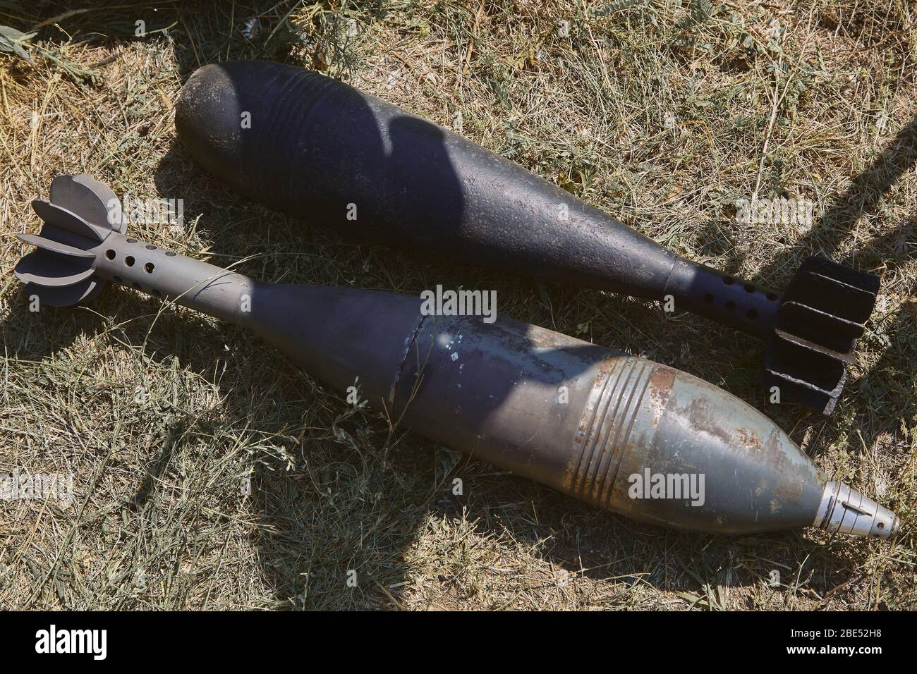 Two unexploded aerial bombs lie on the ground Stock Photo - Alamy