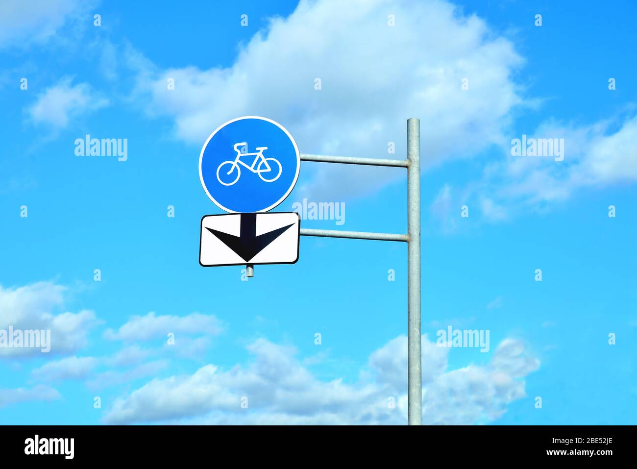 Road signs bike path pointer and arrow on the background of sky and ...