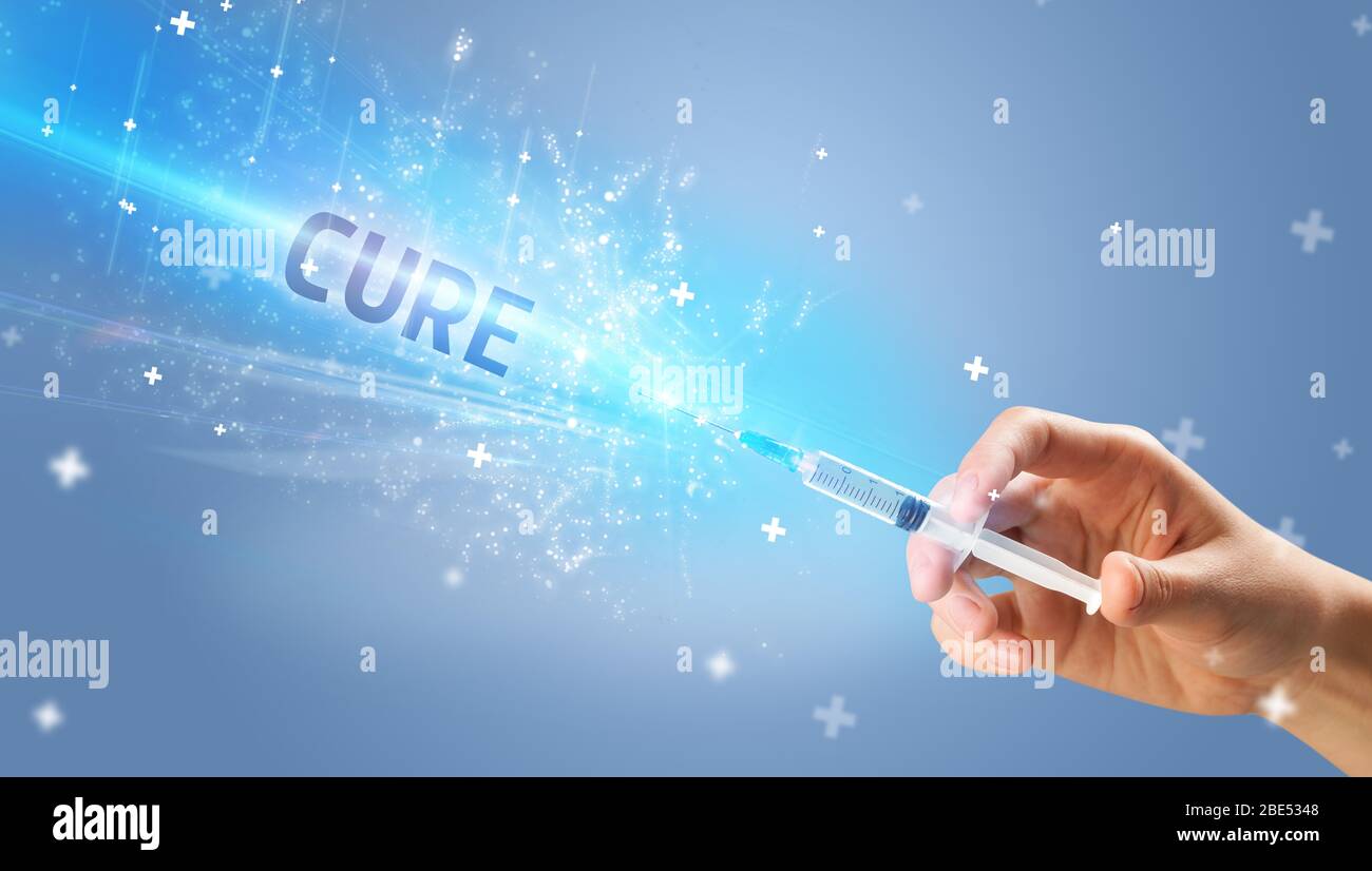 Syringe, medical injection in hand with CURE inscription, medical ...
