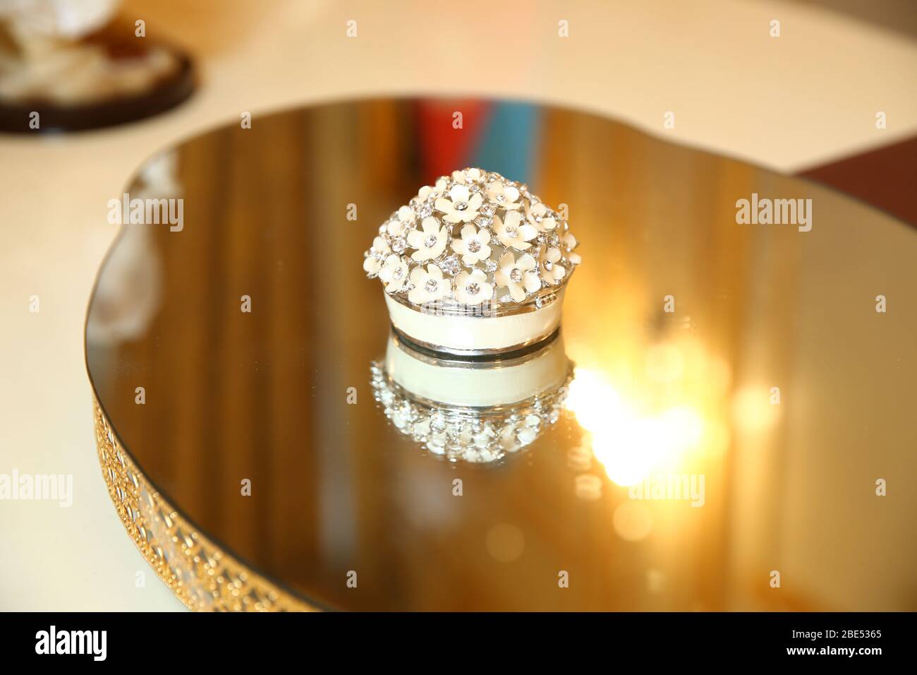 The opposite is true in the mirror. It is placed on the table in ...