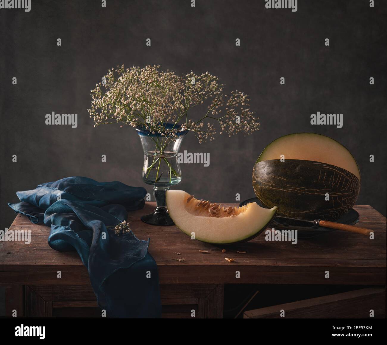 Beautiful still life with melon in blue tones Stock Photo - Alamy