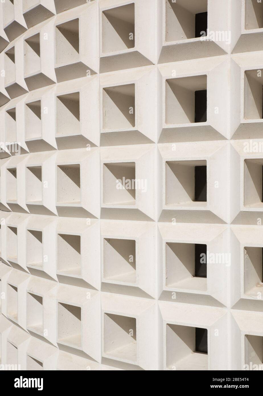 Square openings in a curved concrete wall Stock Photo - Alamy