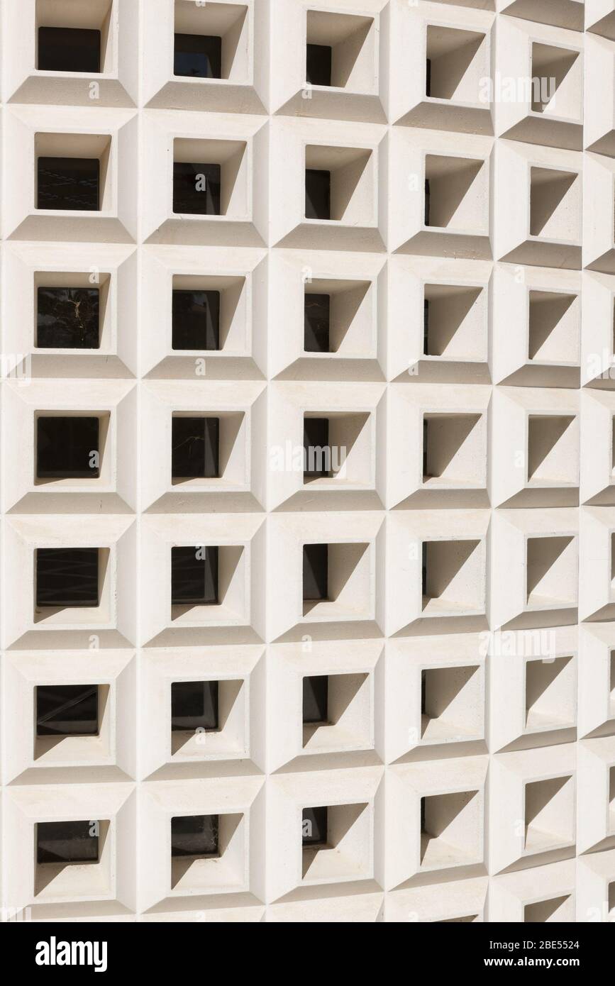 Square openings in a curved concrete wall Stock Photo - Alamy
