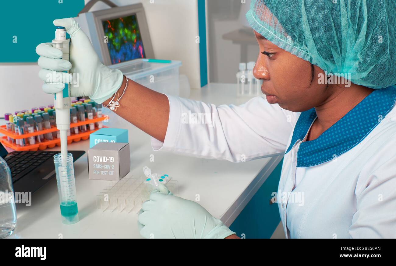 African scientist, technical assistant or graduate in lab coat ...