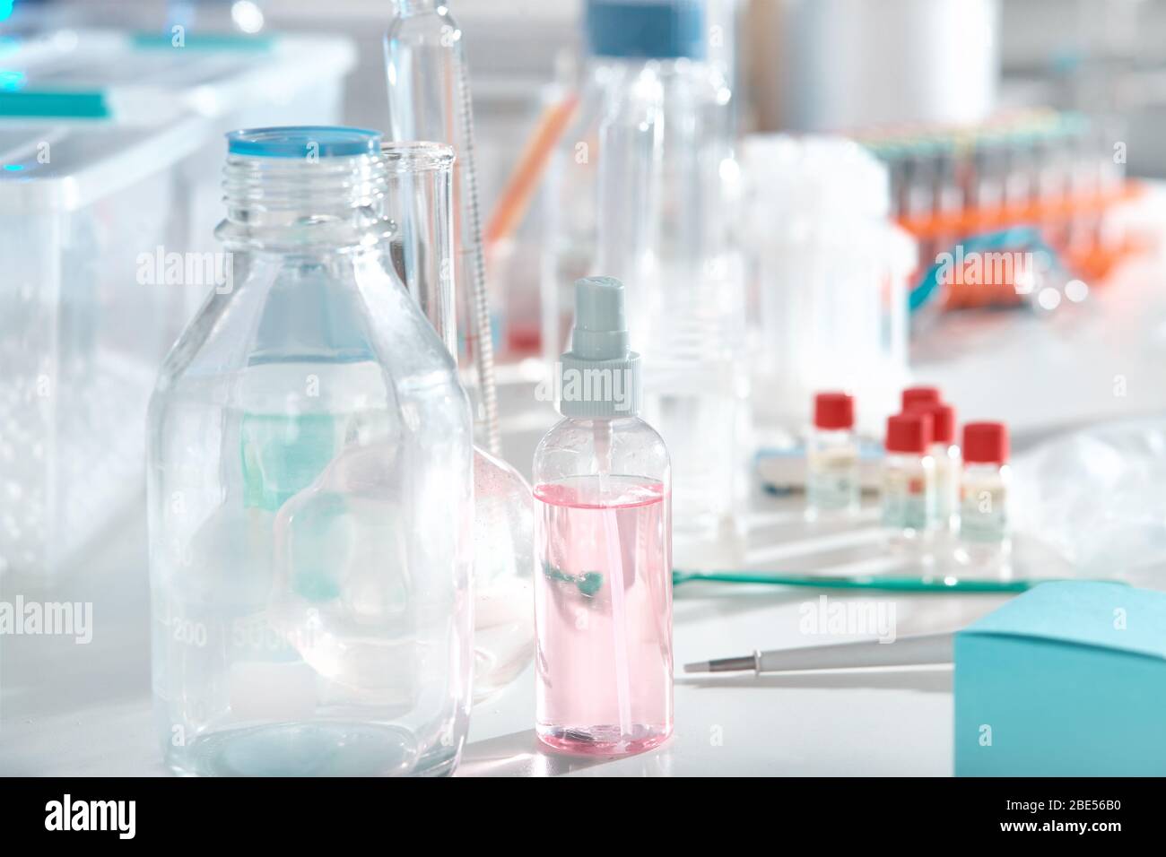 Scientific background with liquid samples in various glass and plastic ...