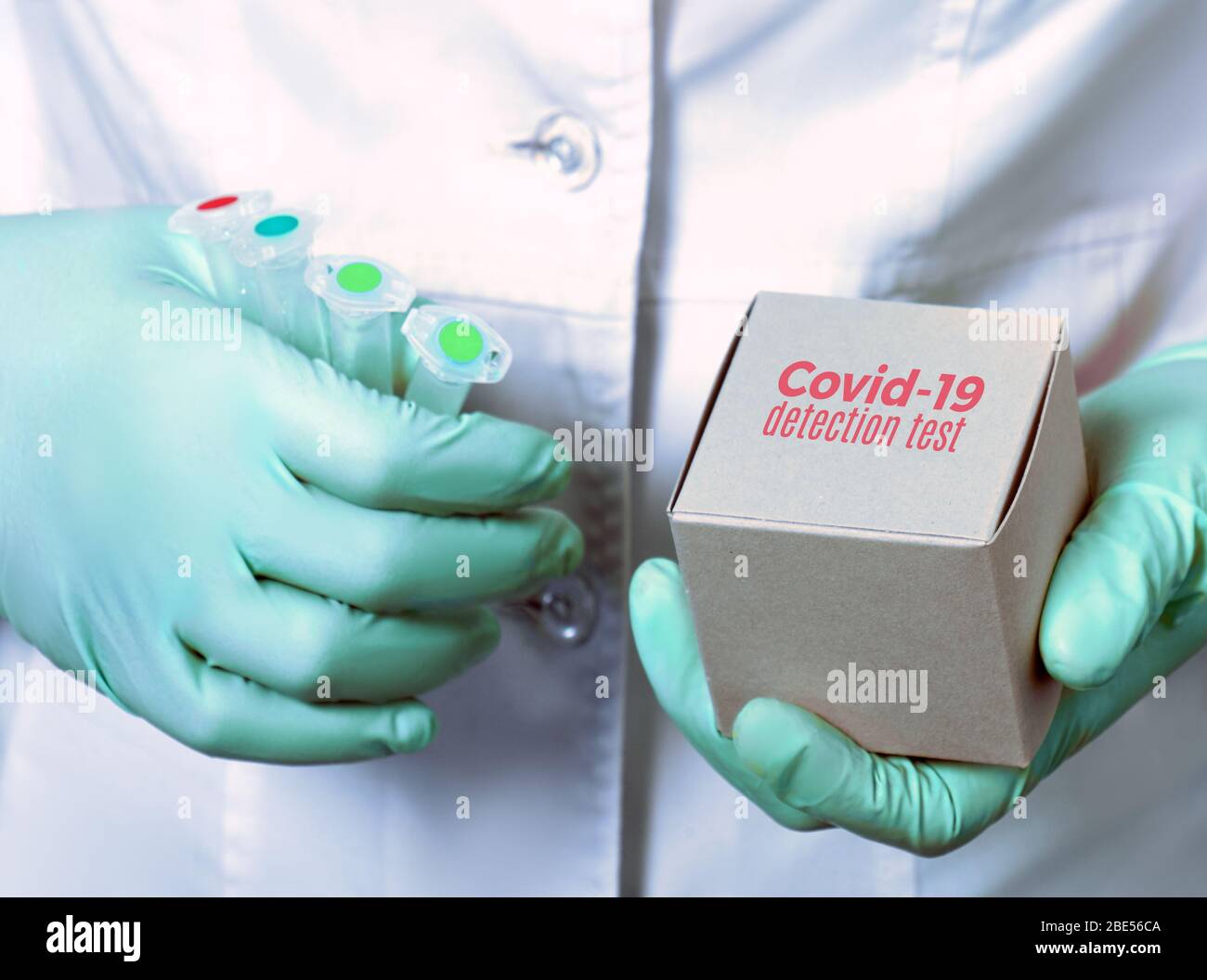 Medic or tech in white gown and gloves holds reagents for diagnostics ...