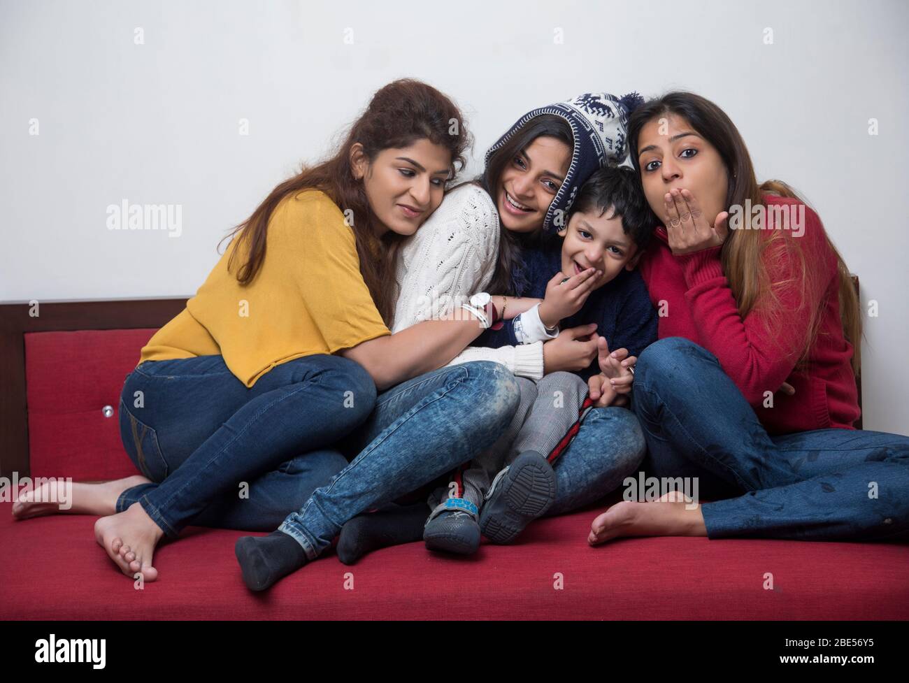 Sisters having fun with their little nephew at home Stock Photo - Alamy