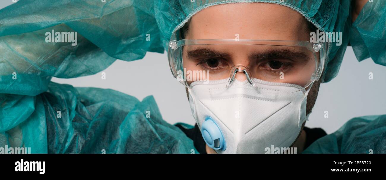 Doctor wearing protection face mask and glasses against coronavirus ...