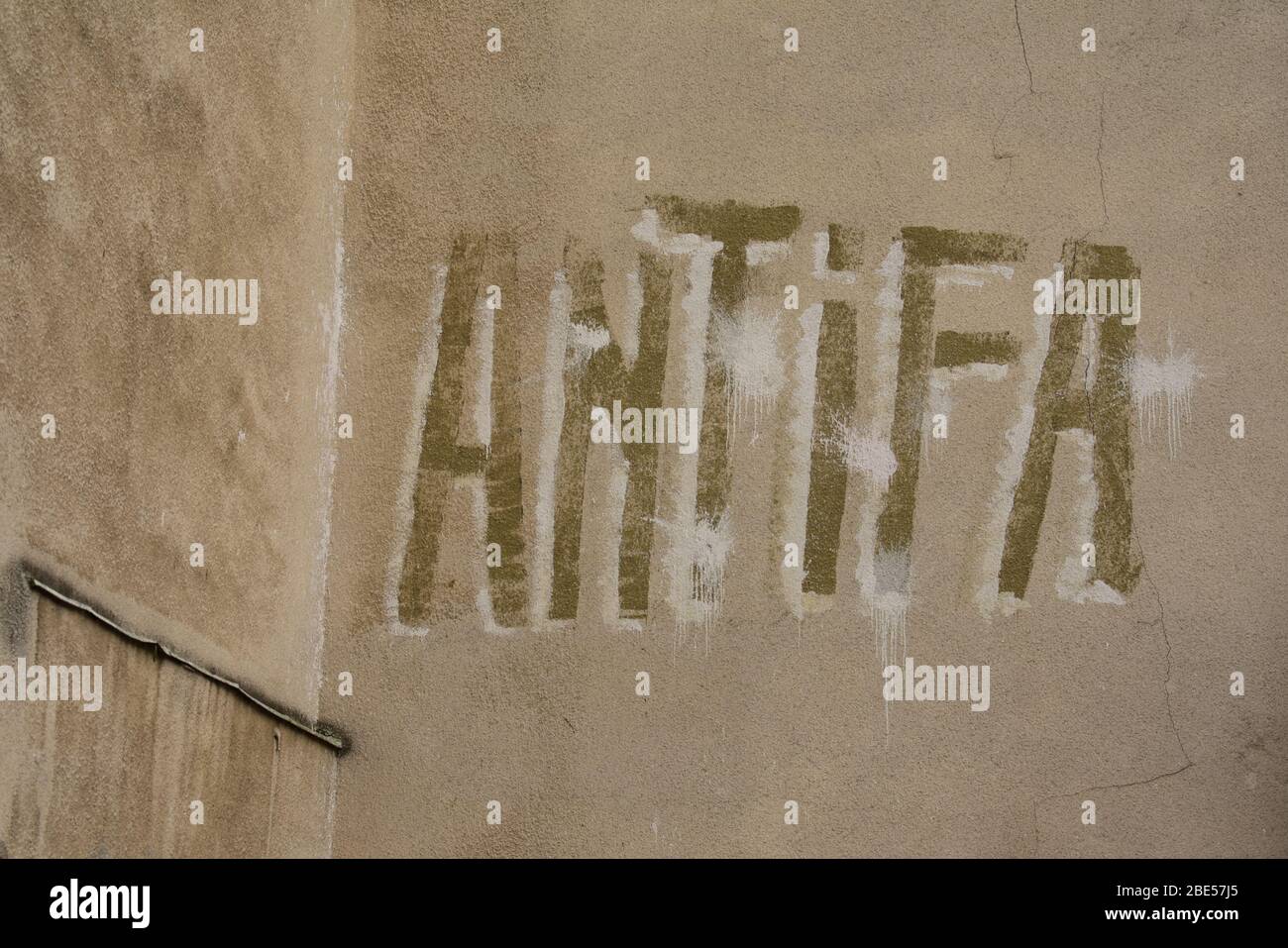 Antifa graffiti on a tan wall in Warsaw Stock Photo - Alamy