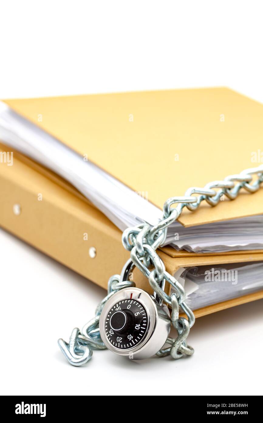 Cardboard document folders locked with chain and padlock. Selective ...
