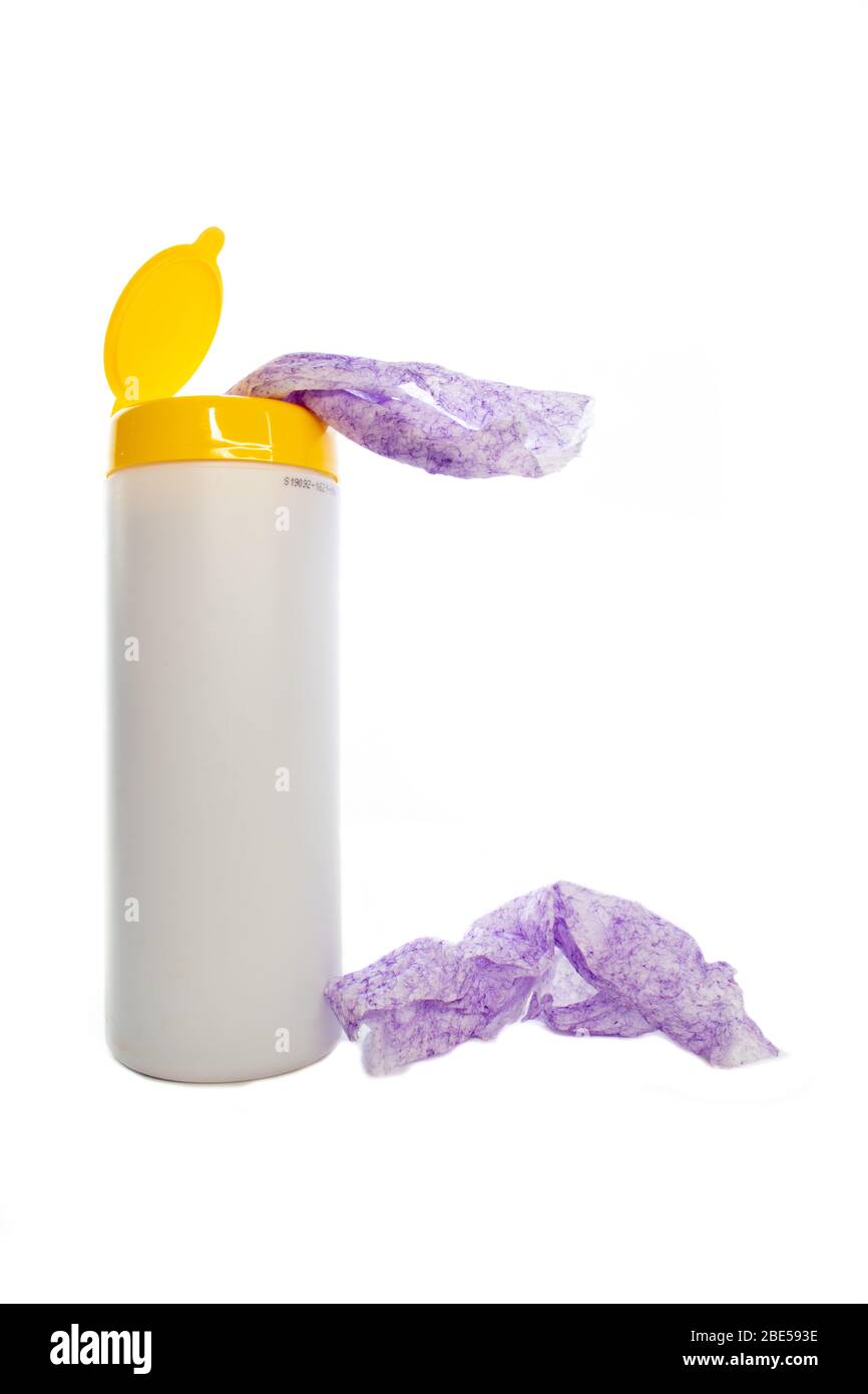 Sanitizing wipe container with a wipe sticking out of the lid and a ...