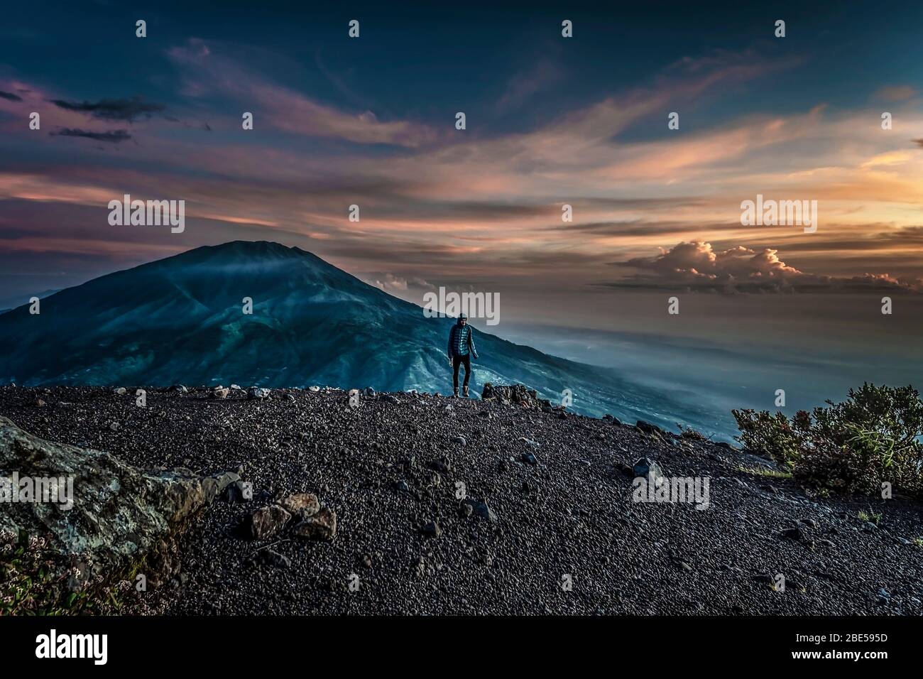 Man walking into sunset hi-res stock photography and images - Alamy