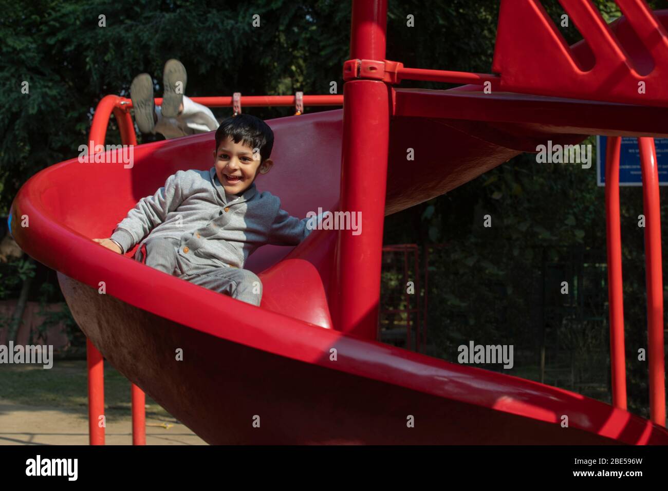 Children sliding hi-res stock photography and images - Alamy