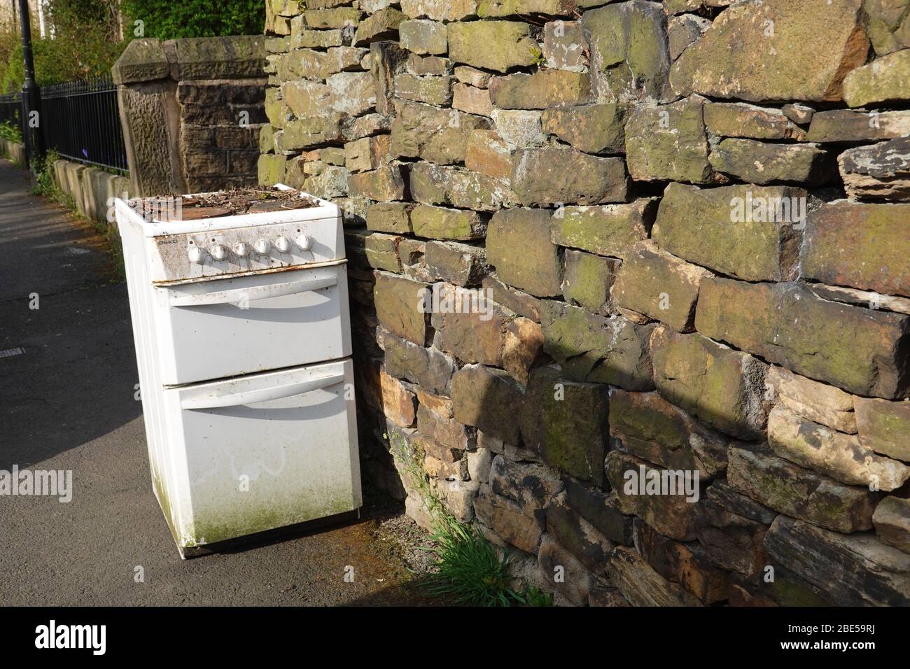 A rusty cooker on the pavement in New Mills, Derbyshire, waiting to be ...