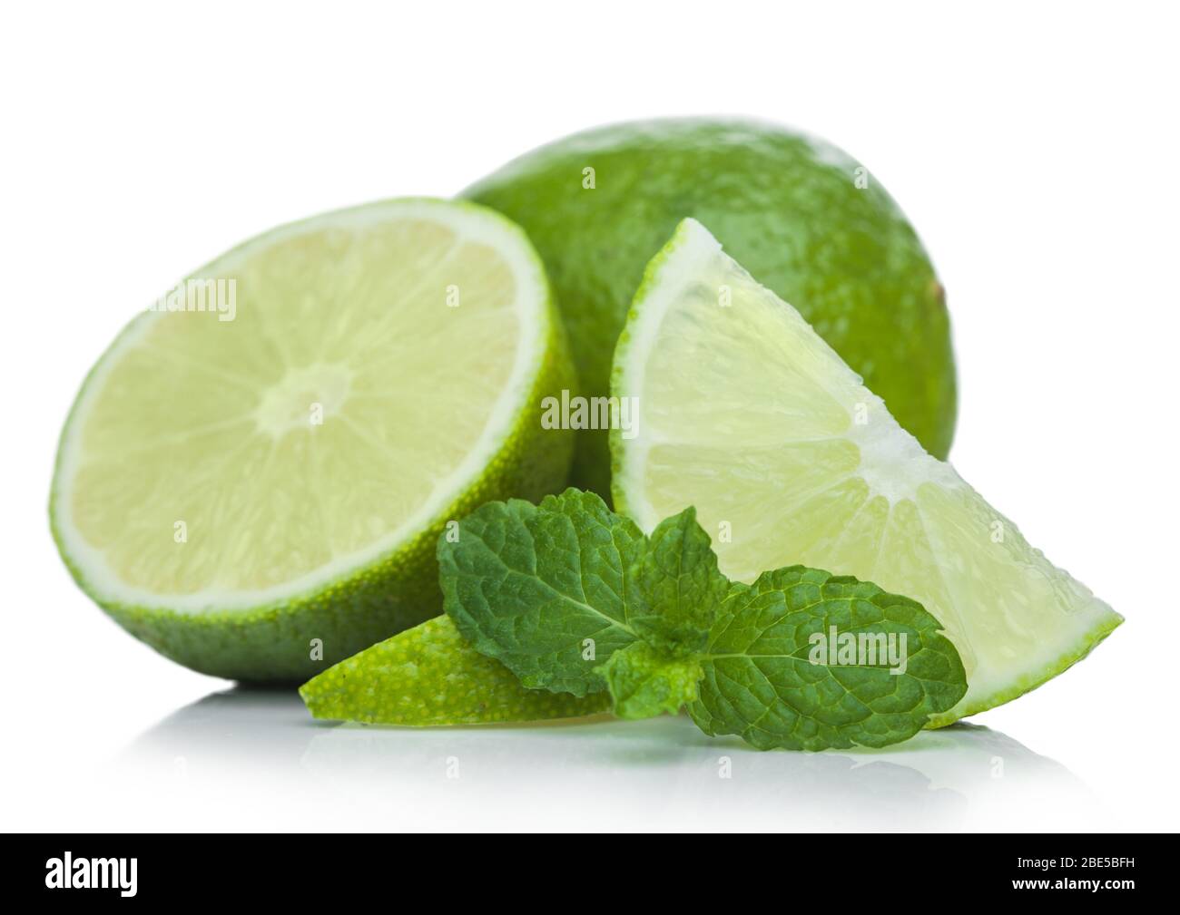 Fresh raw lime with mint leaf on white background for mojito cocktail ...