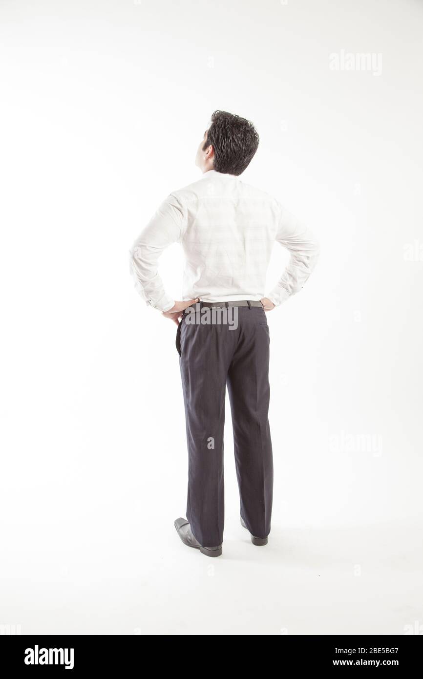 Young corporate office man looking up visioning future of work back ...