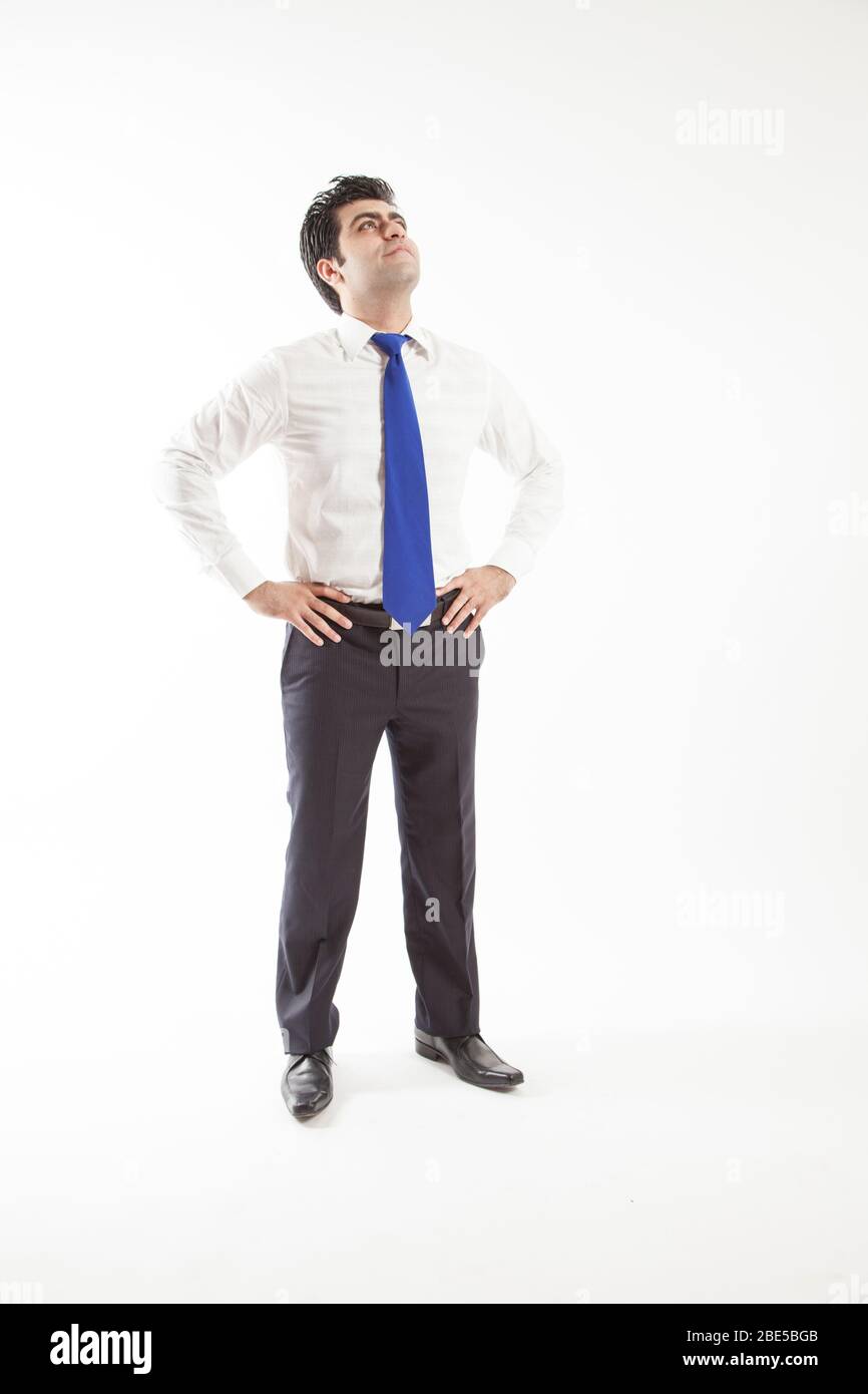 Young corporate office man looking up visioning future of work front ...
