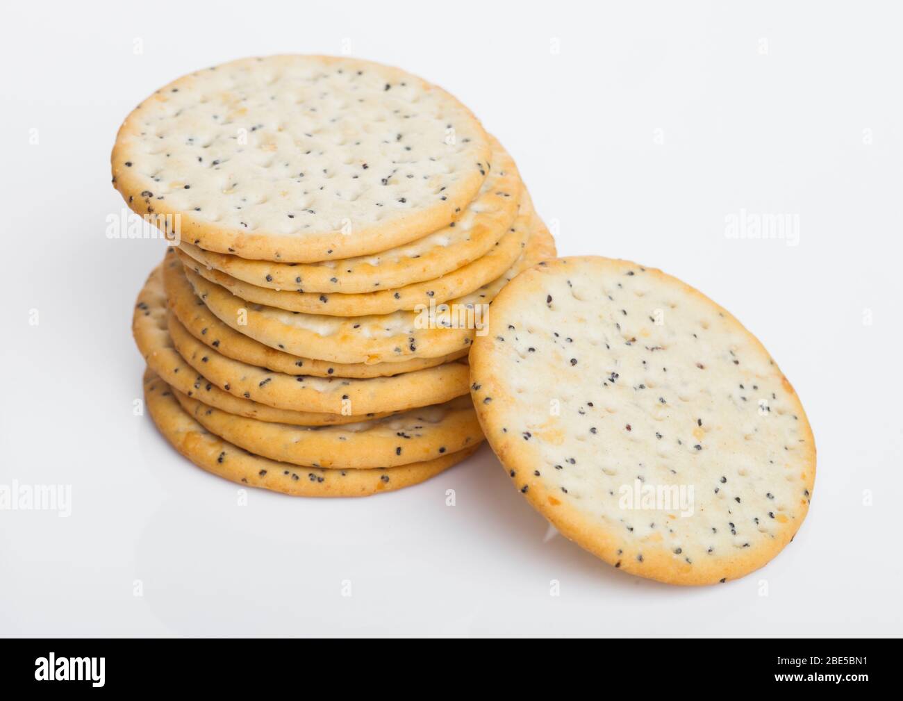 Stack of round organic crispy wheat and five grain salty crackers with ...