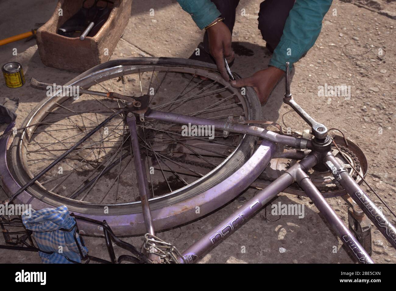 Indian Bicycle mechanic in a workshop in the repair process Stock Photo ...