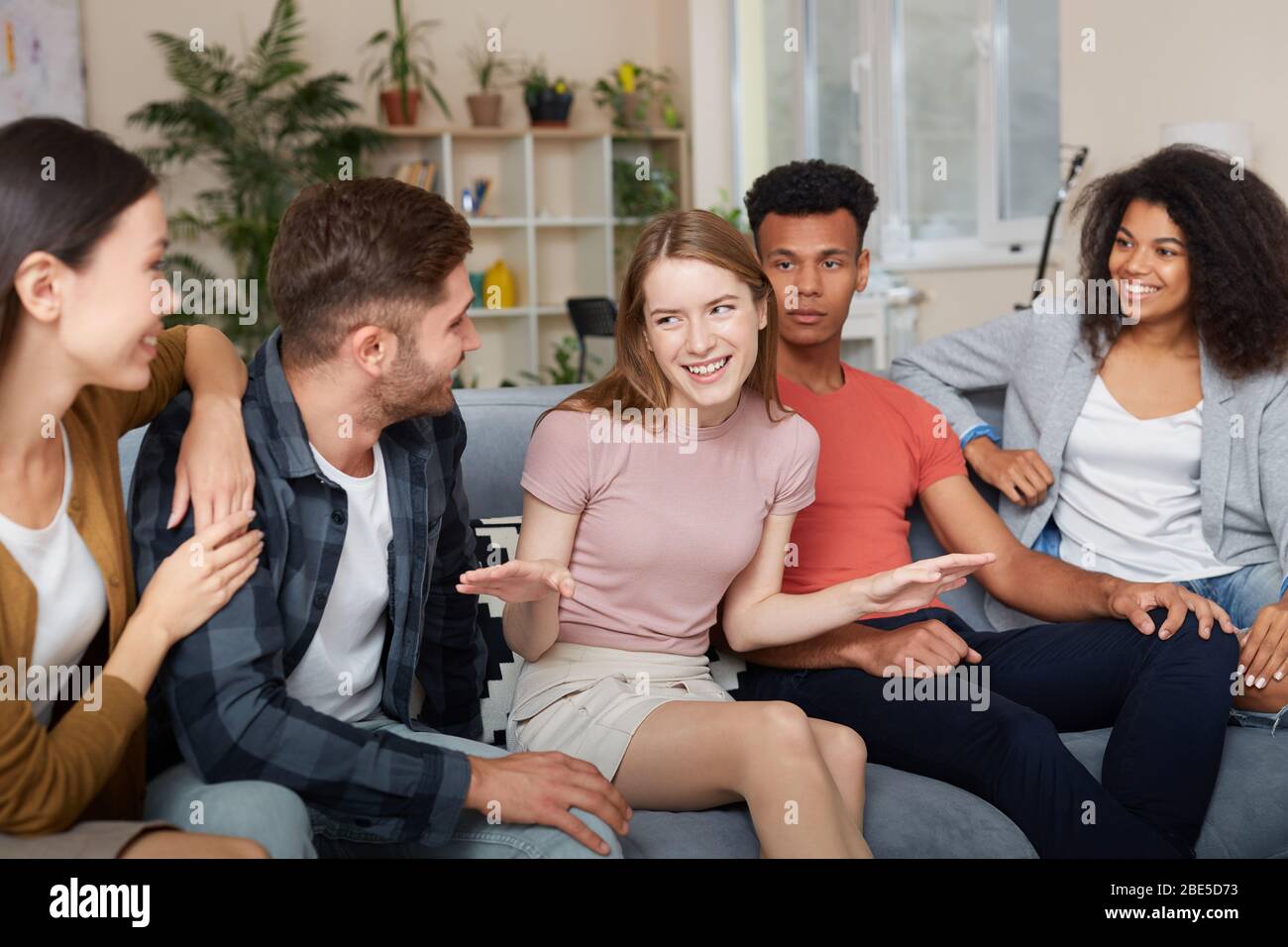 Sharing news. Young beautiful girl discussing something with best ...