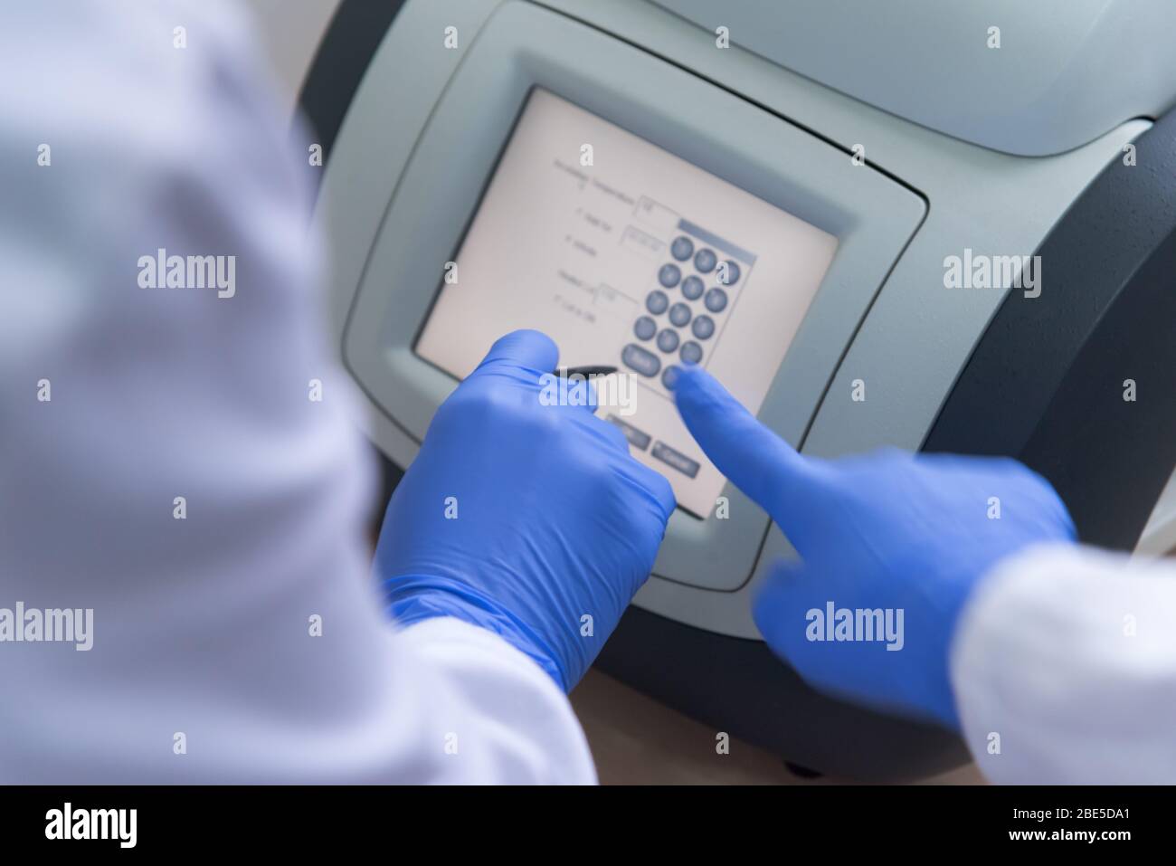 Group of Laboratory scientists working at lab with test tubes, test or ...