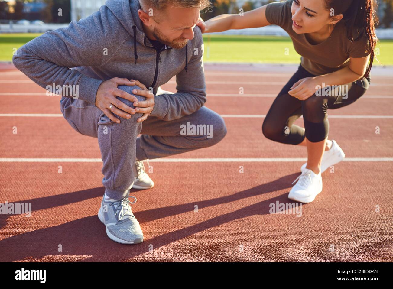 Knee injury in training. A male injured his leg during exercise Stock ...