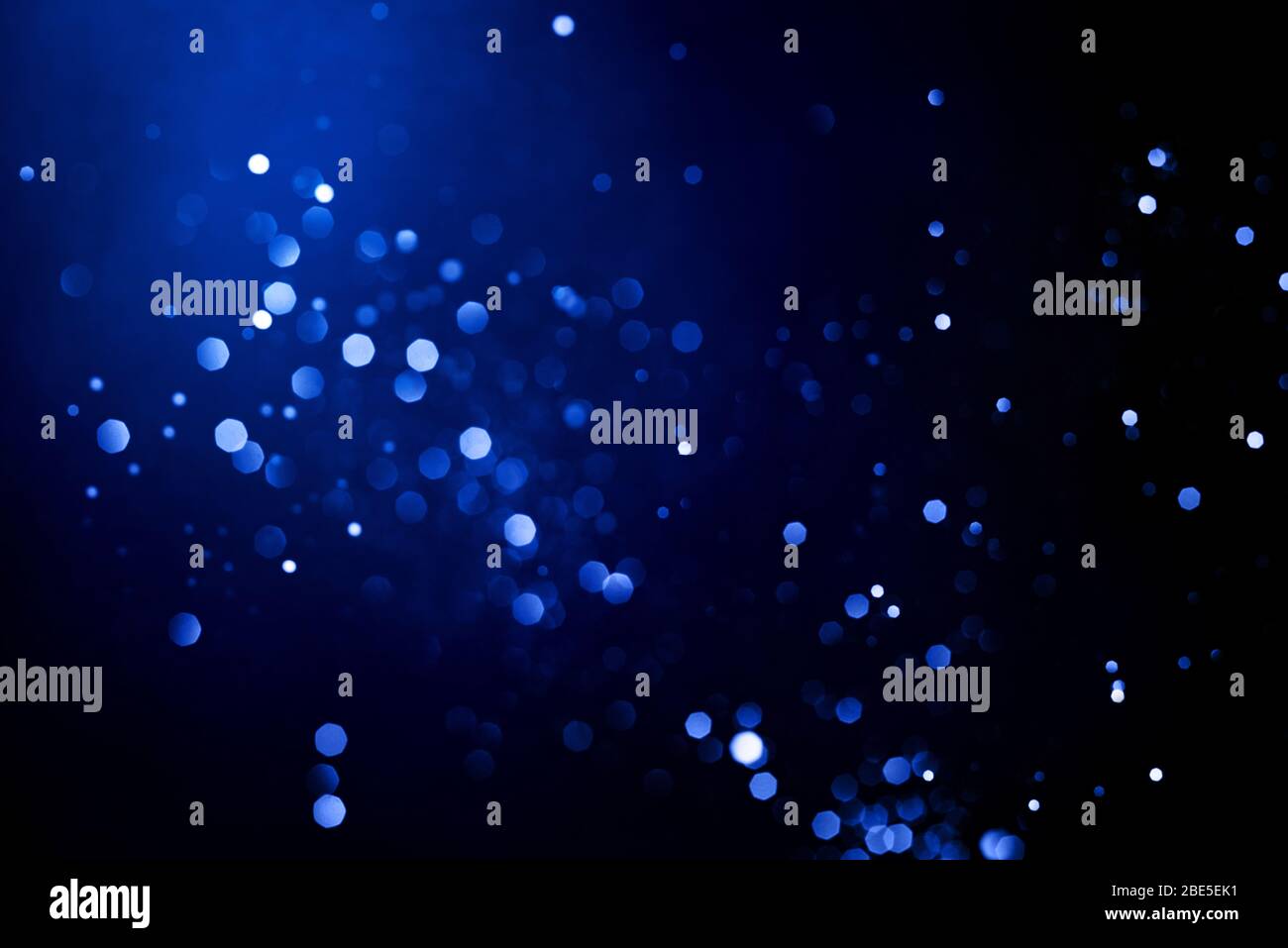 Blue light shine particles bokeh hi-res stock photography and images ...