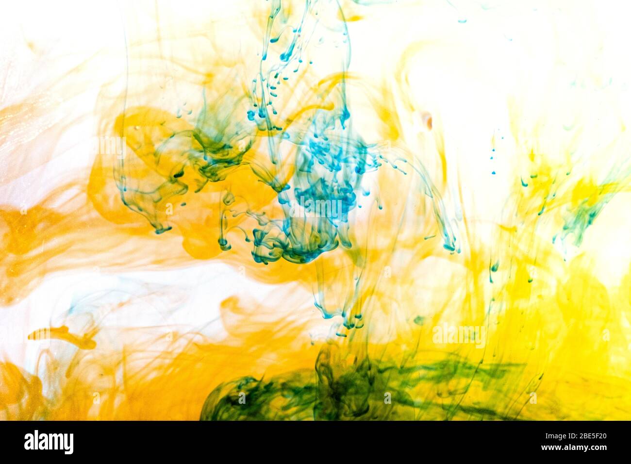 Colored ink cloud grows in water5 Stock Photo - Alamy