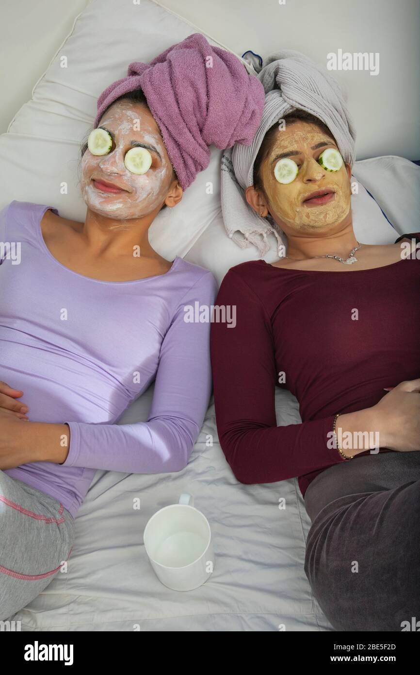 Two sisters doing a skin care routine together at home Stock Photo - Alamy