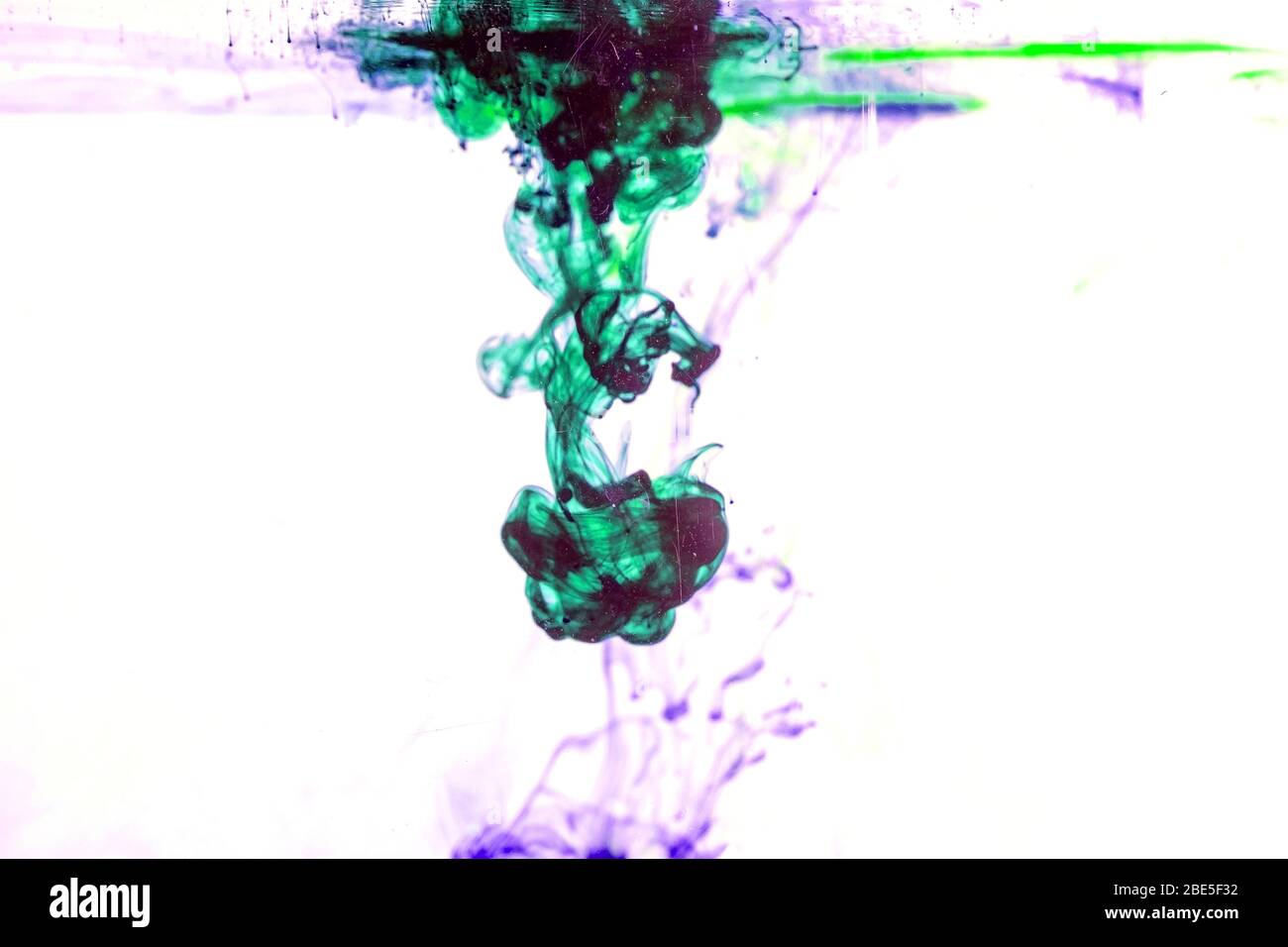 Colored ink cloud grows in water11 Stock Photo - Alamy