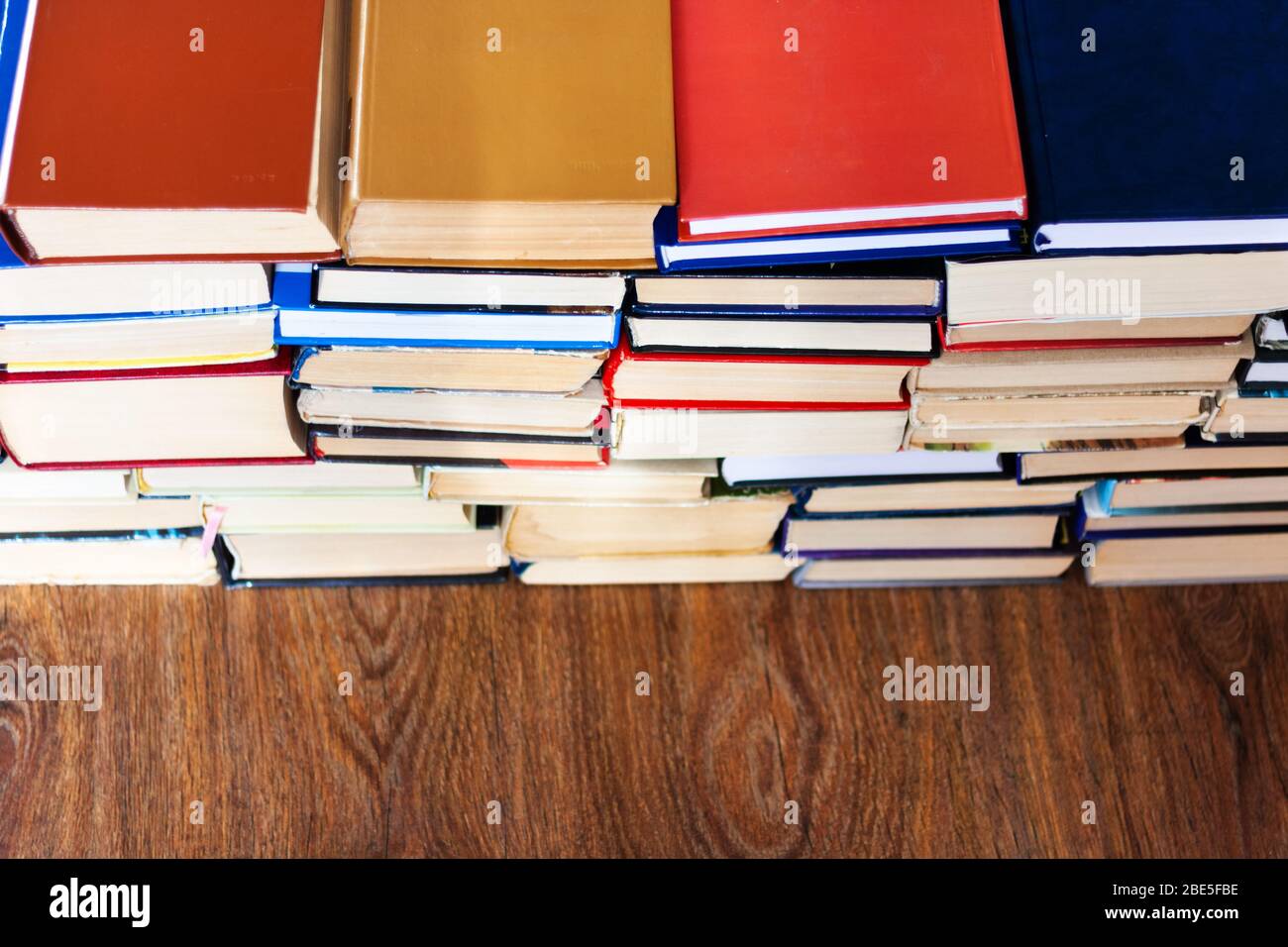 stack of old book on wooden table, education concept background, many ...