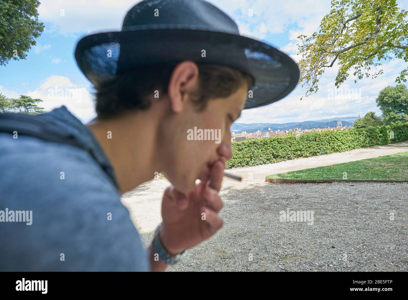 Teen boy smoking cigarette hi-res stock photography and images - Alamy