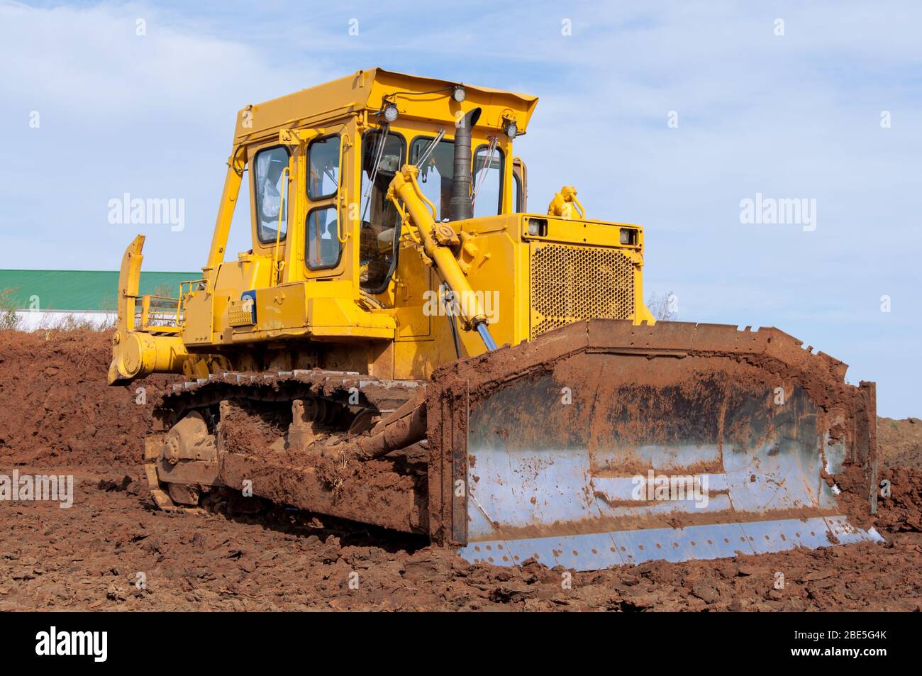 Large construction bulldozer at a construction site. Ground planning at ...