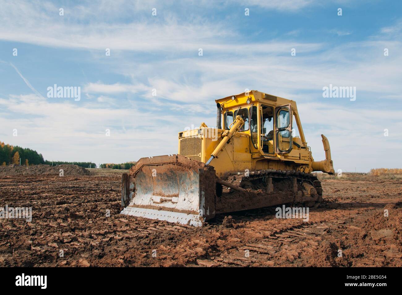 Large construction bulldozer at a construction site. Ground planning at ...