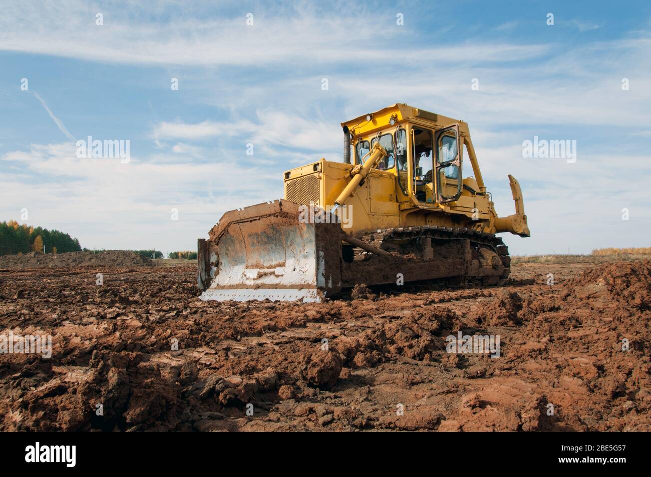 Large construction bulldozer at a construction site. Ground planning at ...