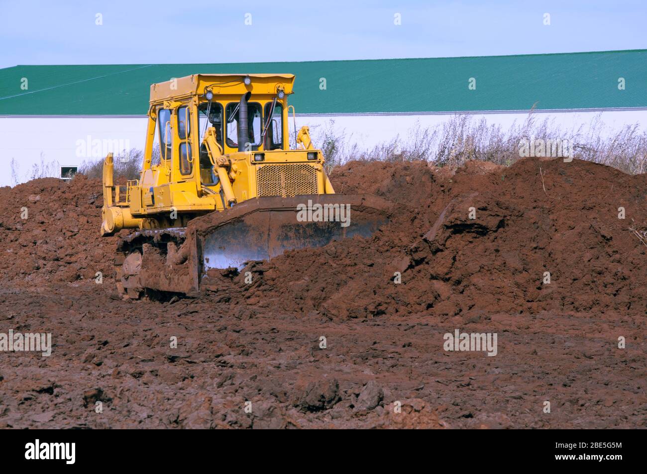 Large construction bulldozer at a construction site. Ground planning at ...