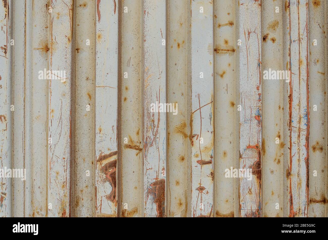 Beige steel wall with rust Stock Photo - Alamy