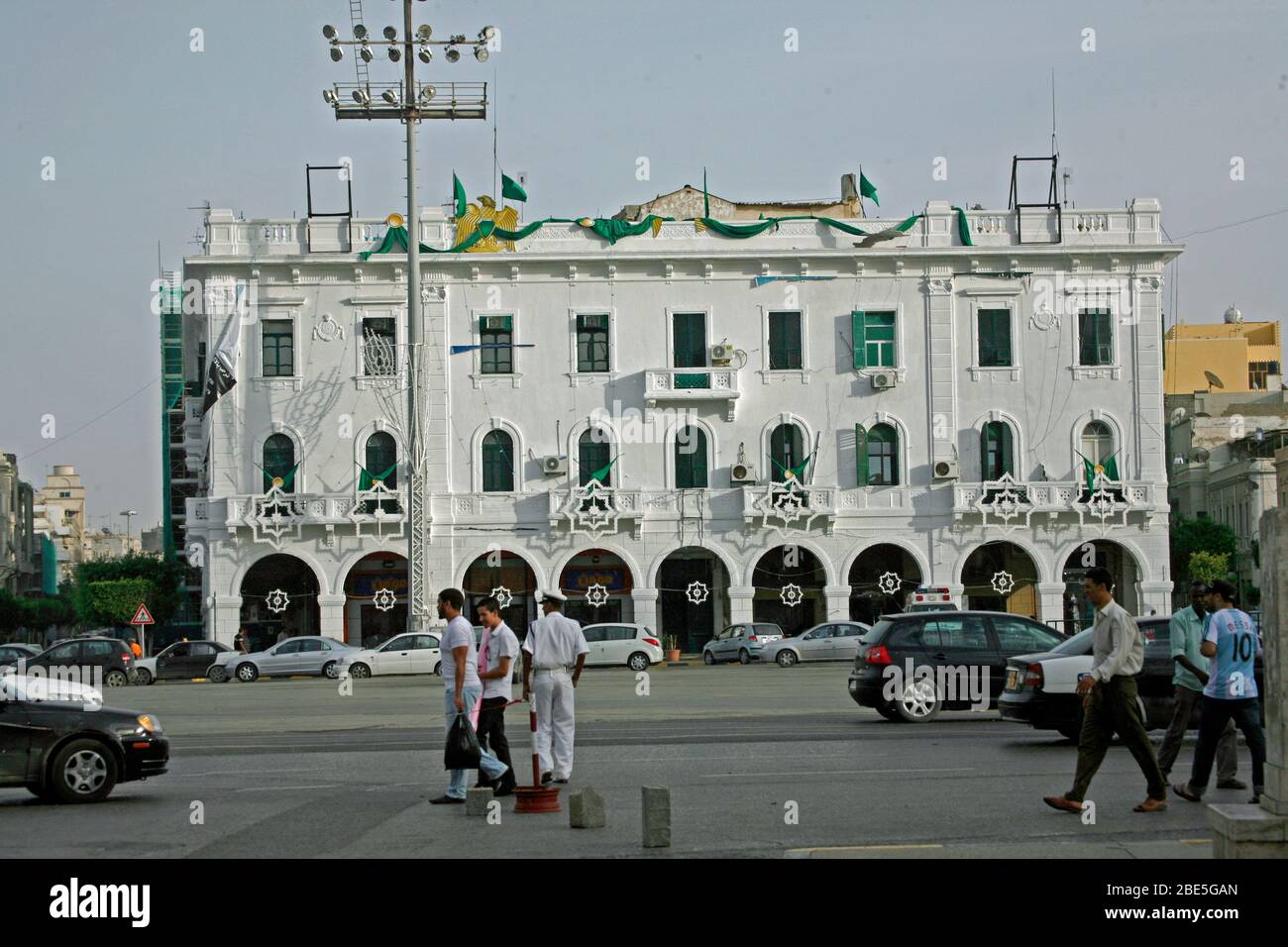 Italian white colonial building on the side of green square Stock Photo ...