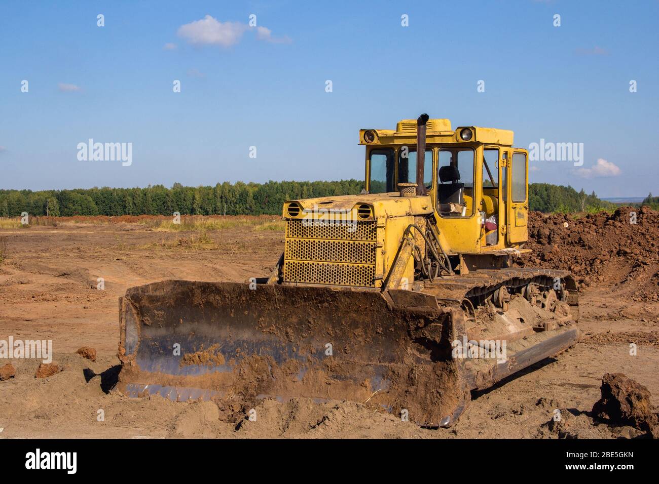 Equipment for land planning at a construction site. Large bulldozer ...