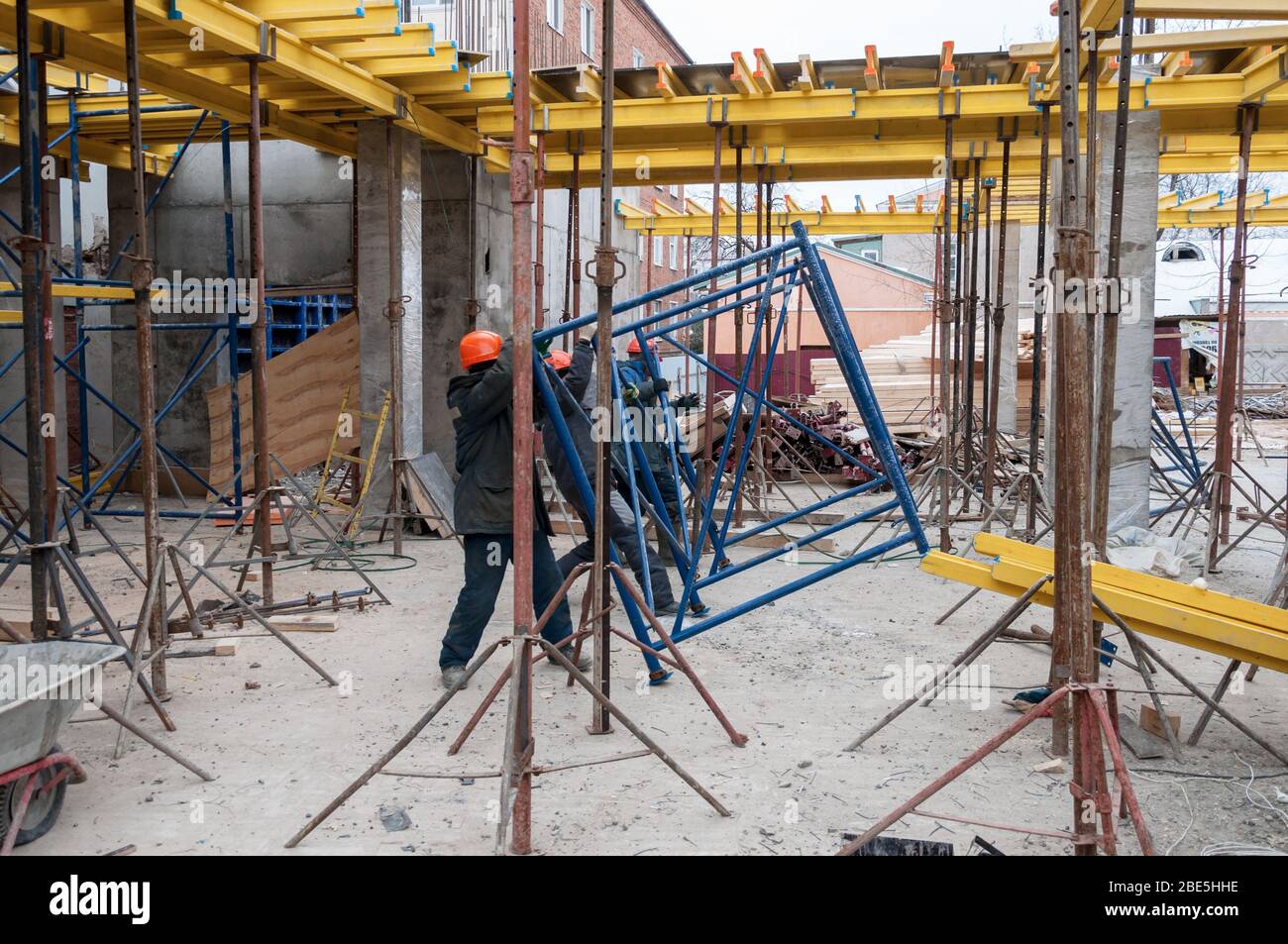 Installation of scaffolding at the construction site. Construction ...