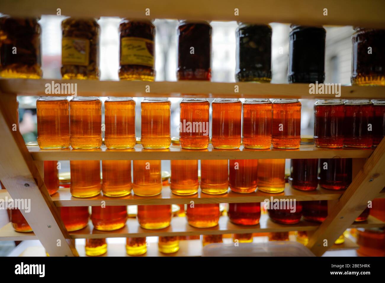 Shallow depth of field (selective focus) image with jars full of honey ...