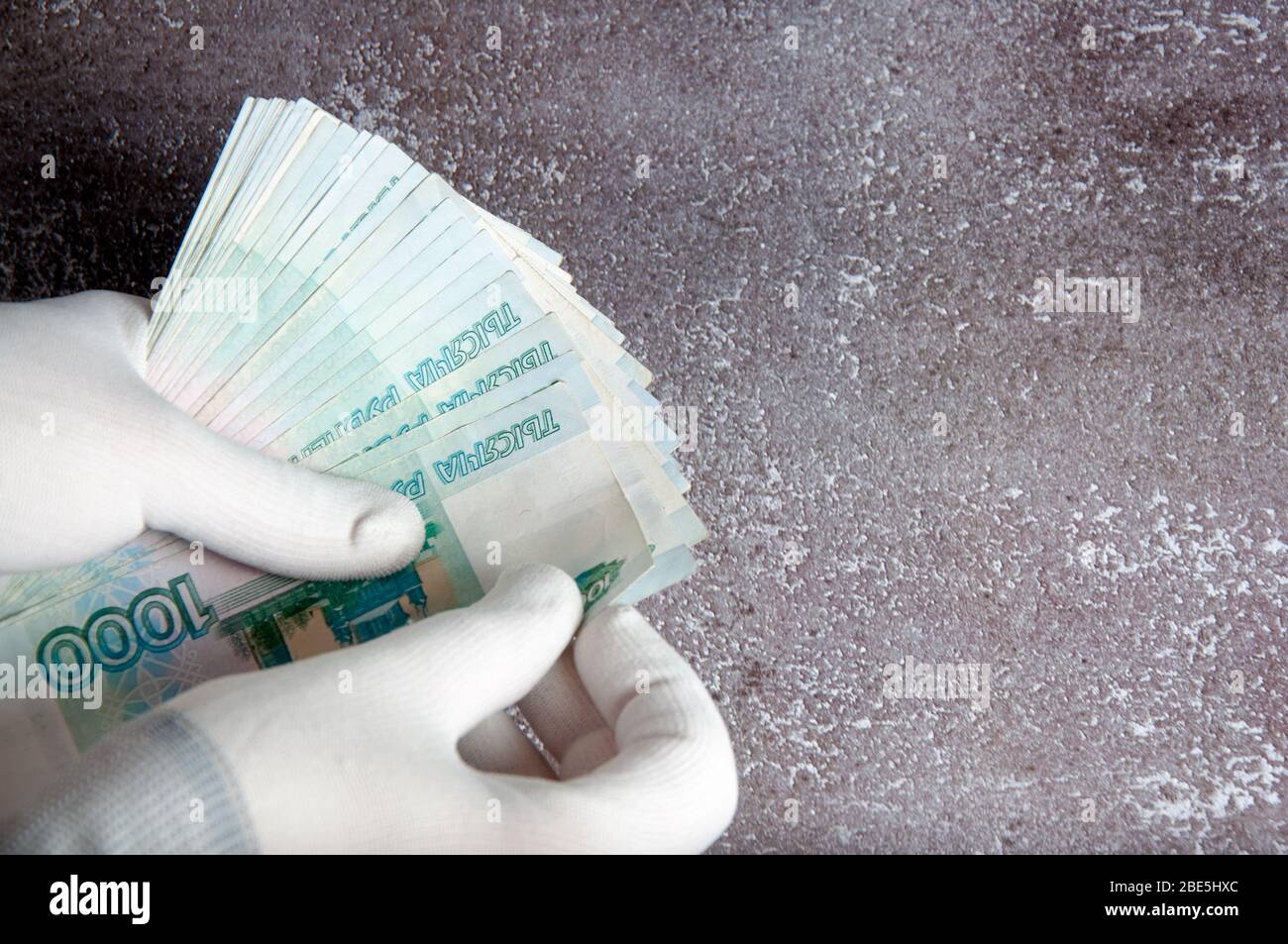 Counting Russian rubles with hands in white gloves. Money calculation ...