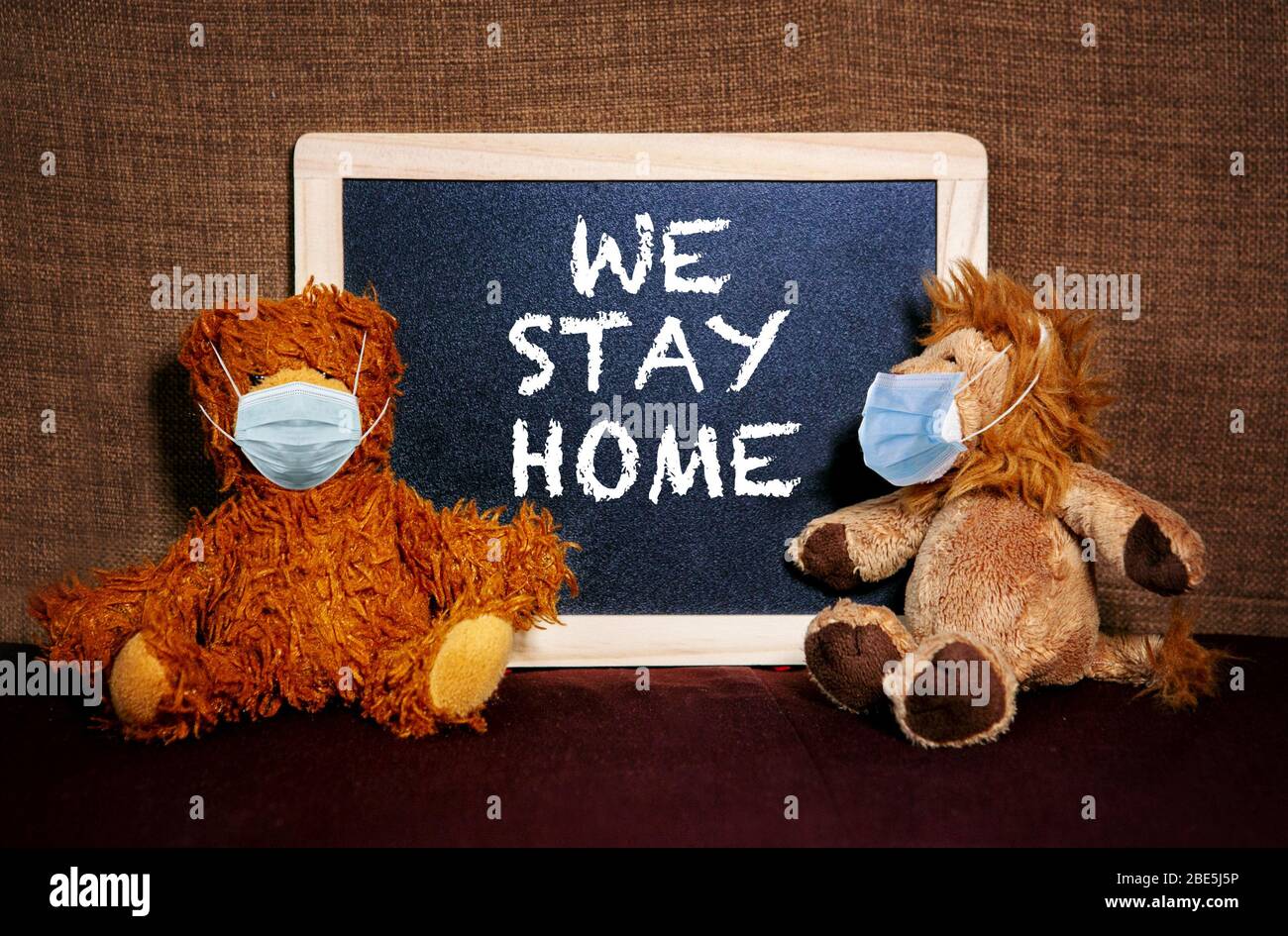 teddy bears with face mask and chalkboard and the words We Stay Home ...