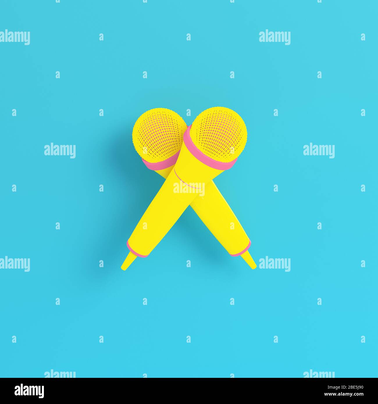 Yellow microphone on bright blue background in pastel colors ...