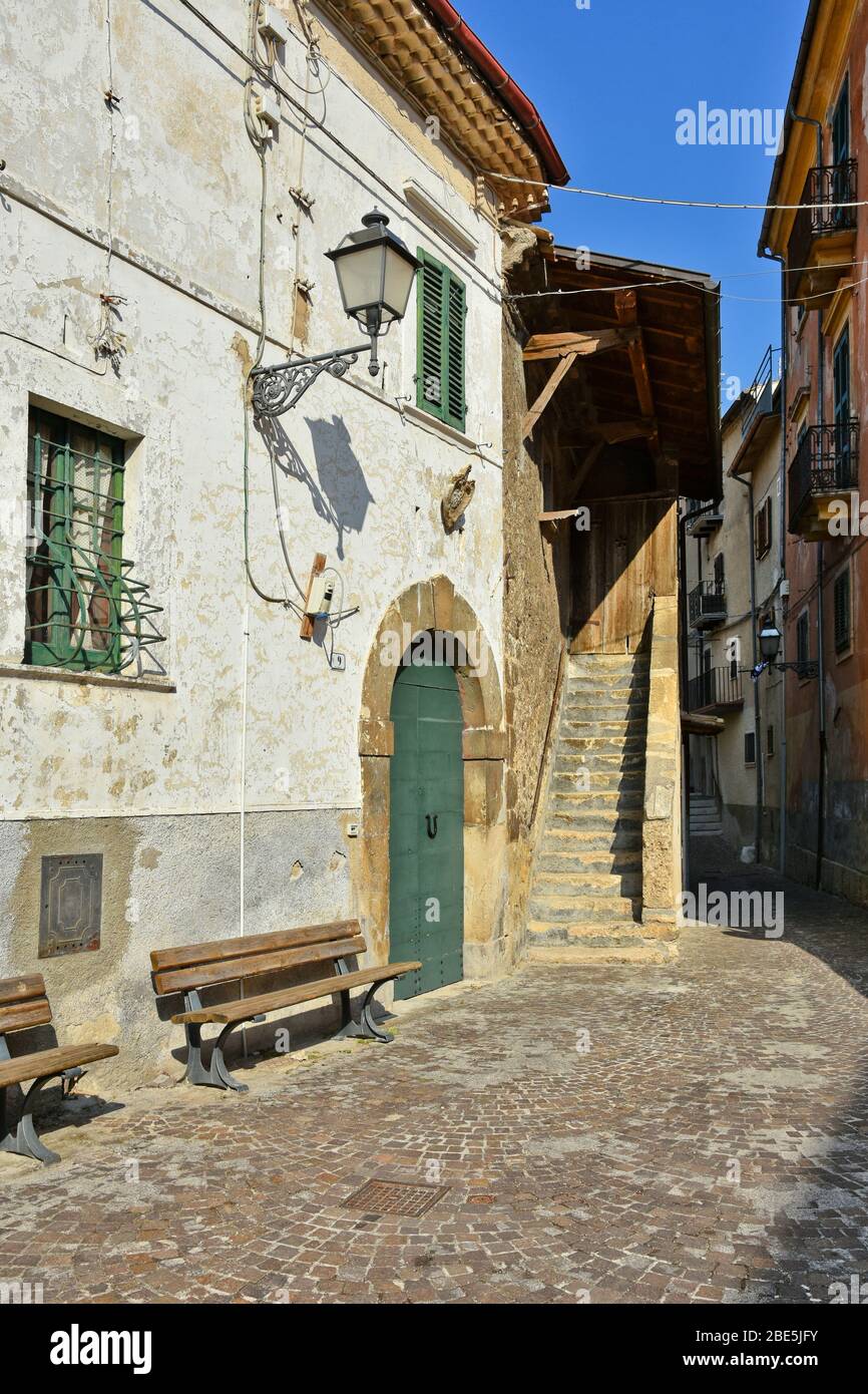 A narrow street between the old houses of Castrovalva, a town in the ...