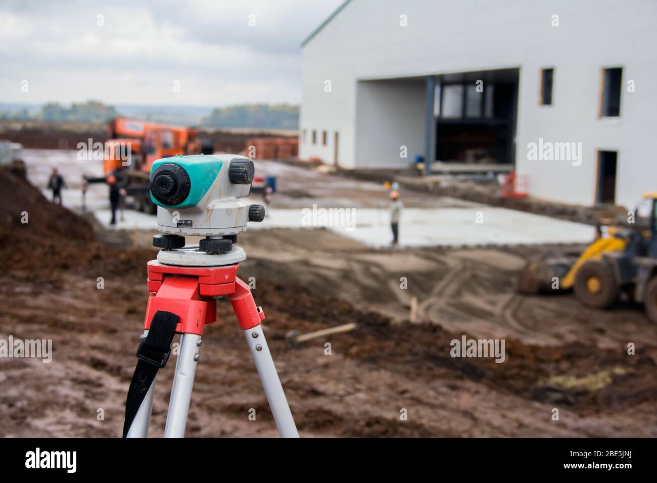 Surveying measuring equipment level theodolite on tripod. Construction ...