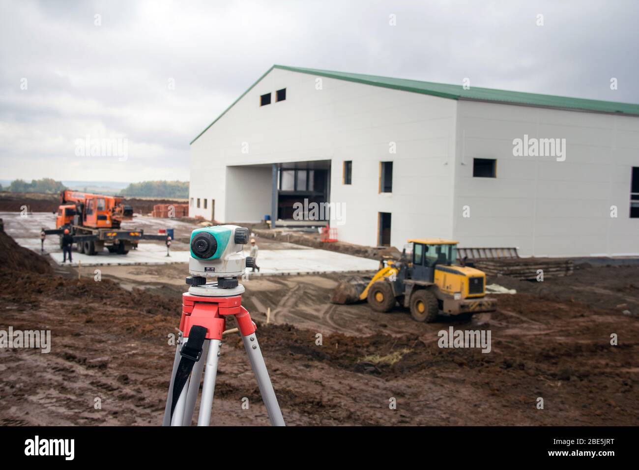 Surveying measuring equipment level theodolite on tripod. Construction ...