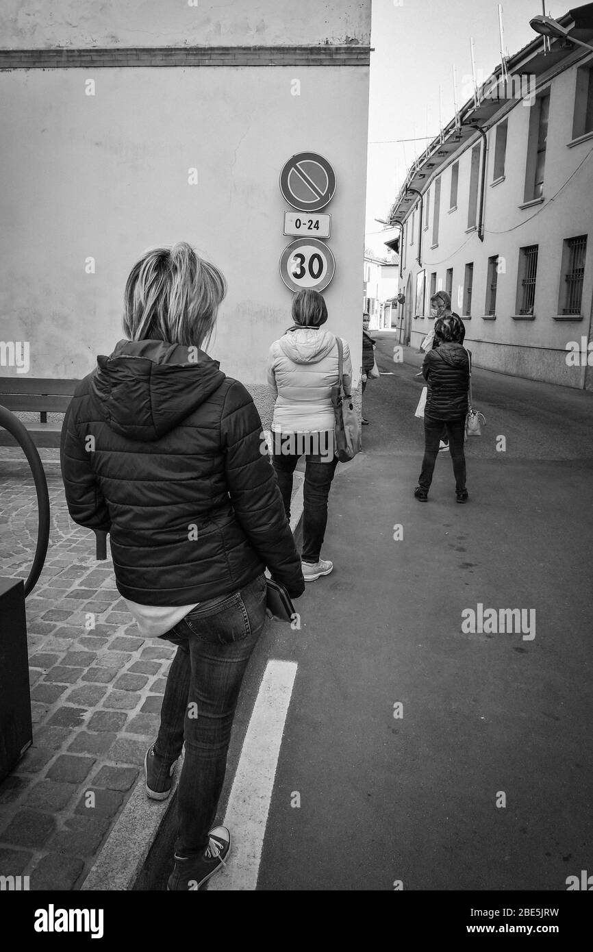 Italy, Lombardy, Ossona, people in line to buy bread Stock Photo - Alamy