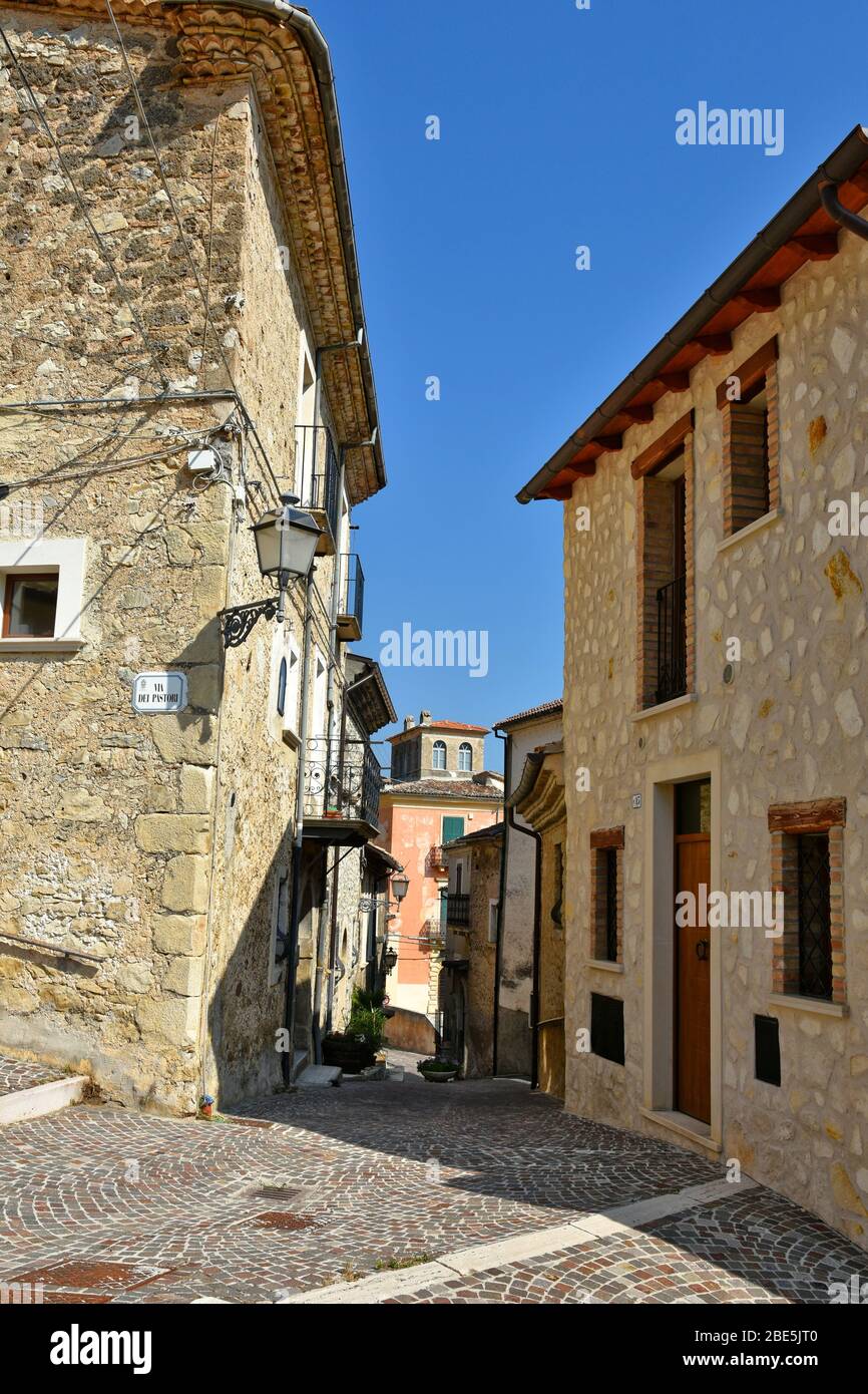 A narrow street between the old houses of Castrovalva, a town in the ...